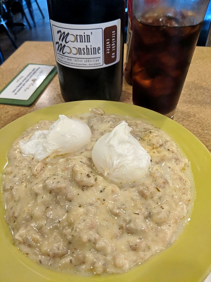 Comfort in a bowl—creamy biscuits and gravy topped with poached eggs that break open like sunrise, paired with their signature Mornin' Moonshine coffee.