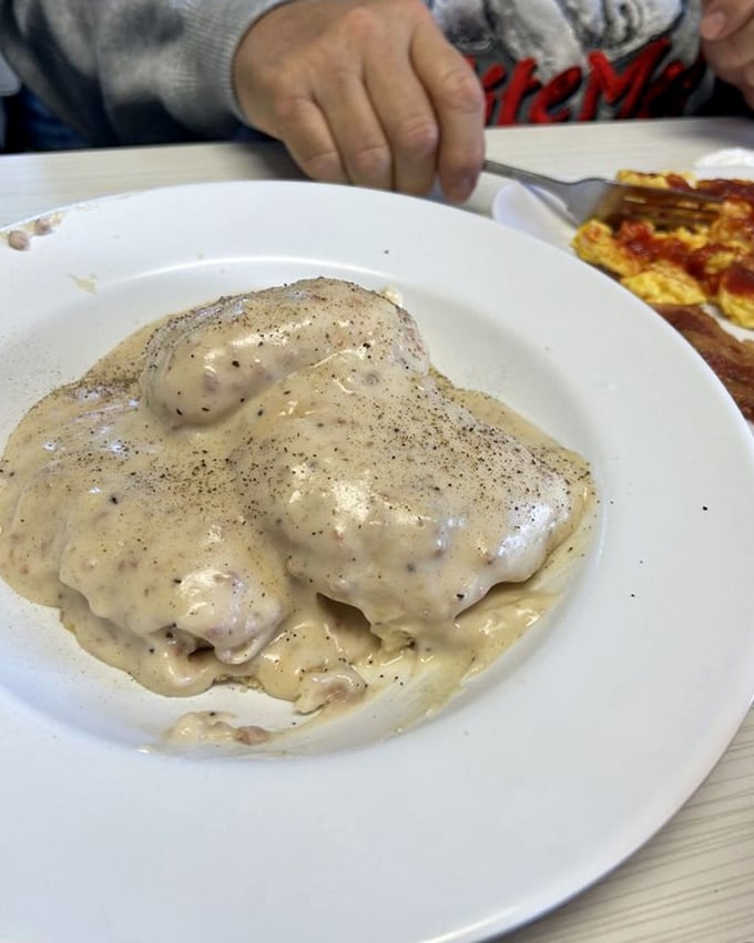 Behold the star attraction: a cloud-like biscuit swimming in peppery sausage gravy that's worth crossing county lines for.