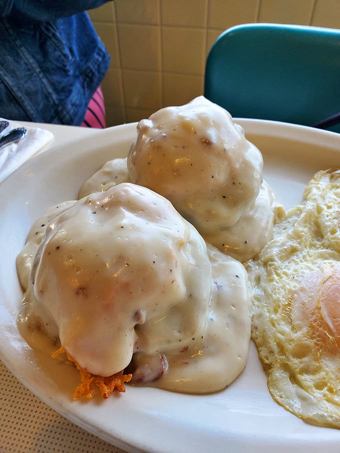 These biscuits and gravy aren't just breakfast—they're an edible hug. Fluffy clouds of dough swimming in peppery cream gravy that would make your grandma jealous.