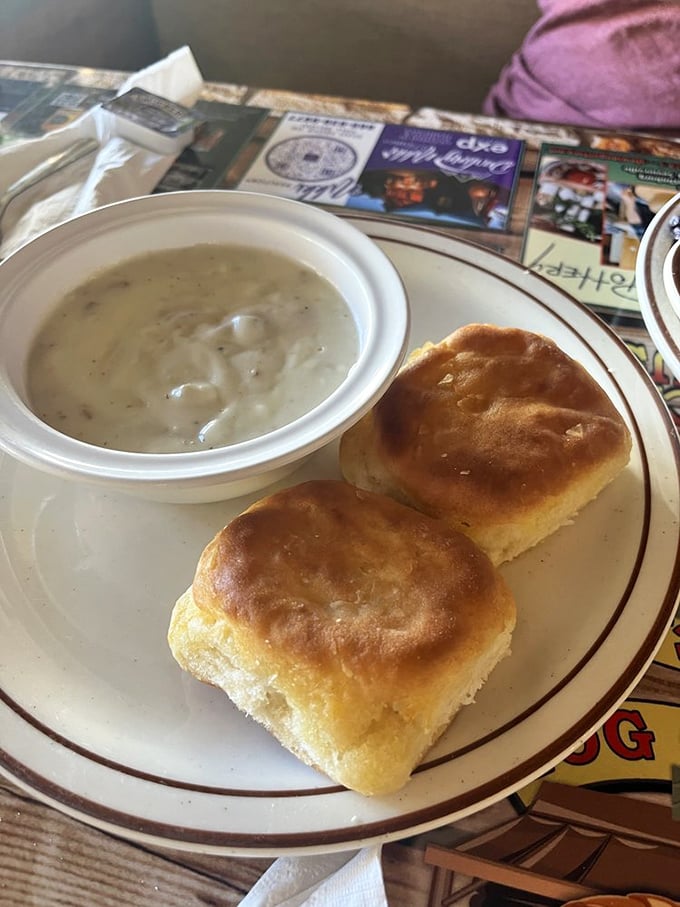 These aren't just biscuits and gravy—they're fluffy clouds of Southern comfort swimming in a sea of peppery, sausage-studded heaven.