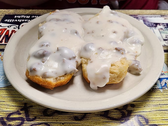 Behold the star attraction: biscuits smothered in creamy sausage gravy. Not all heroes wear capes – some wear gravy.