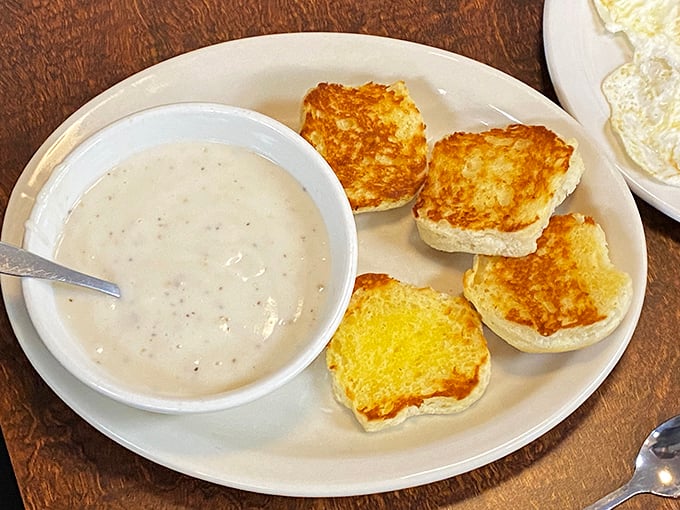Biscuits and gravy that would make your grandmother both jealous and proud—golden-toasted perfection meets creamy, pepper-flecked salvation.
