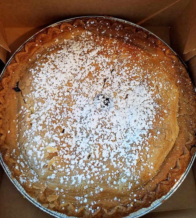 Behold the powdered sugar-dusted masterpiece that launches a thousand detours to Deale. This pie doesn't just satisfy cravings—it creates devotees.