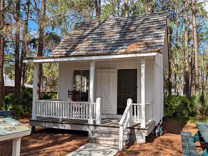 This charming white cottage might be small by today's McMansion standards, but its inviting porch practically begs you to sit a spell and wave at passersby.