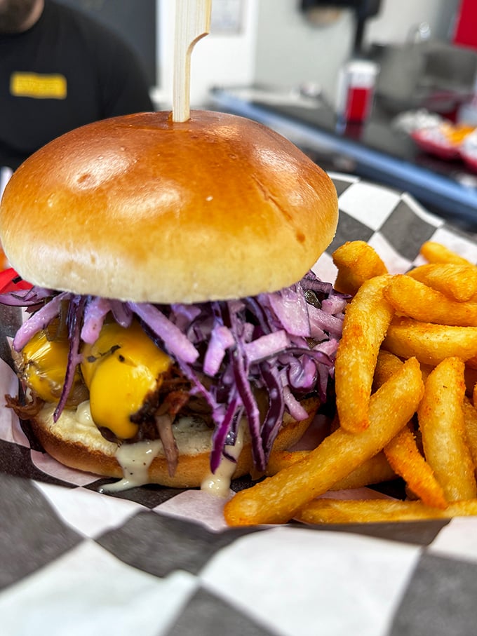 The legendary Braizy Daze burger: purple cabbage slaw meets beef perfection in beautiful chaos.