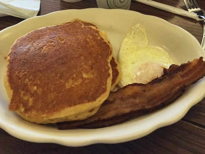 Golden-brown pancake perfection alongside eggs and bacon—the breakfast trifecta that's kept Michigan running for generations.