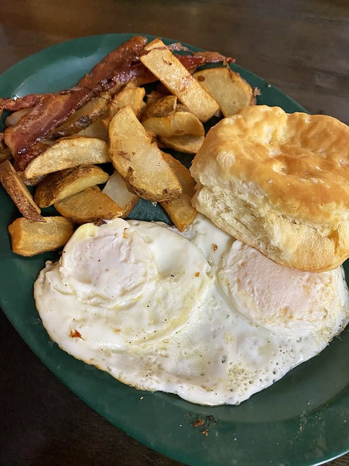 Sunny-side perfection meets home fries and a biscuit that would make your grandmother both proud and jealous.