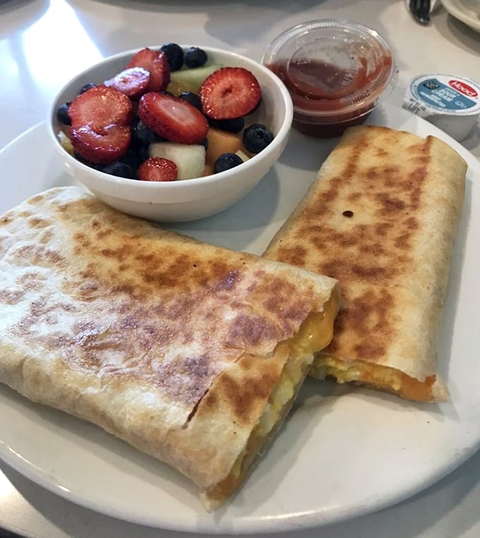 The legendary breakfast burrito arrives with a side of fresh fruit that makes you feel virtuous while committing delicious morning indulgence.