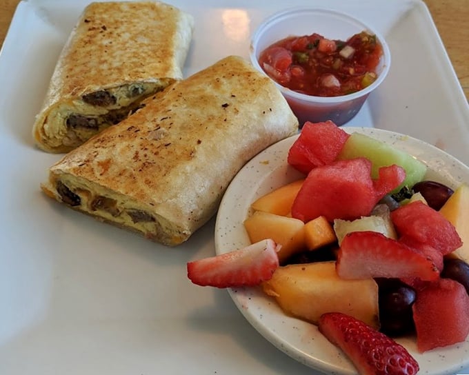 This breakfast burrito doesn't just come with fresh fruit—it comes with a side of morning happiness. The salsa adds that perfect wake-up kick.