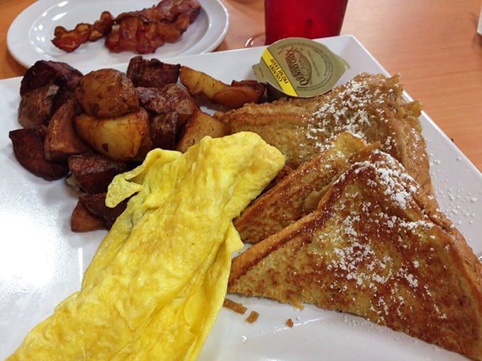 Breakfast architecture at its finest. That French toast has been dusted with powdered sugar and dignity.