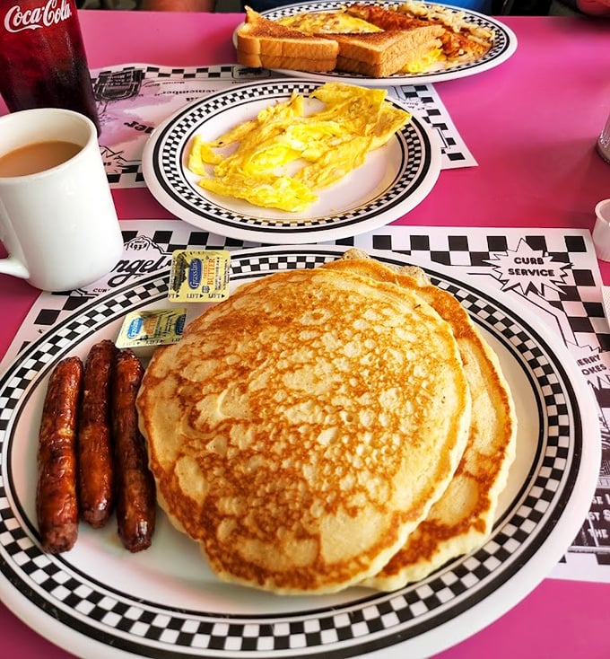 Pancakes the size of small frisbees share table space with perfectly cooked eggs. This isn't breakfast—it's an edible hug on a plate.