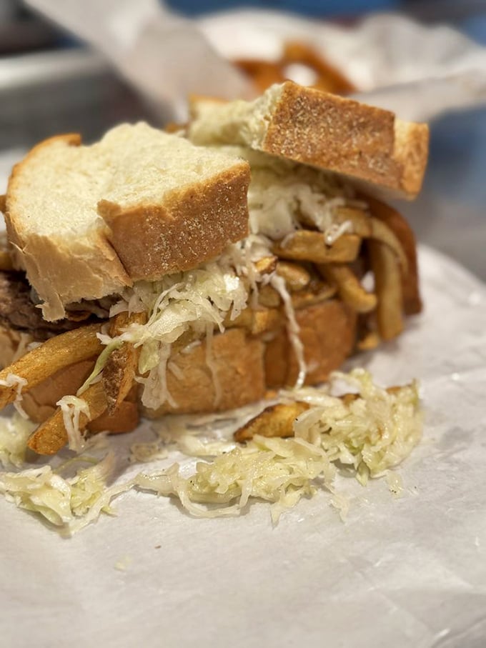 Architecture that puts the Empire State Building to shame. This breakfast sandwich stacks bread, meat, slaw, and those signature fries into edible perfection.
