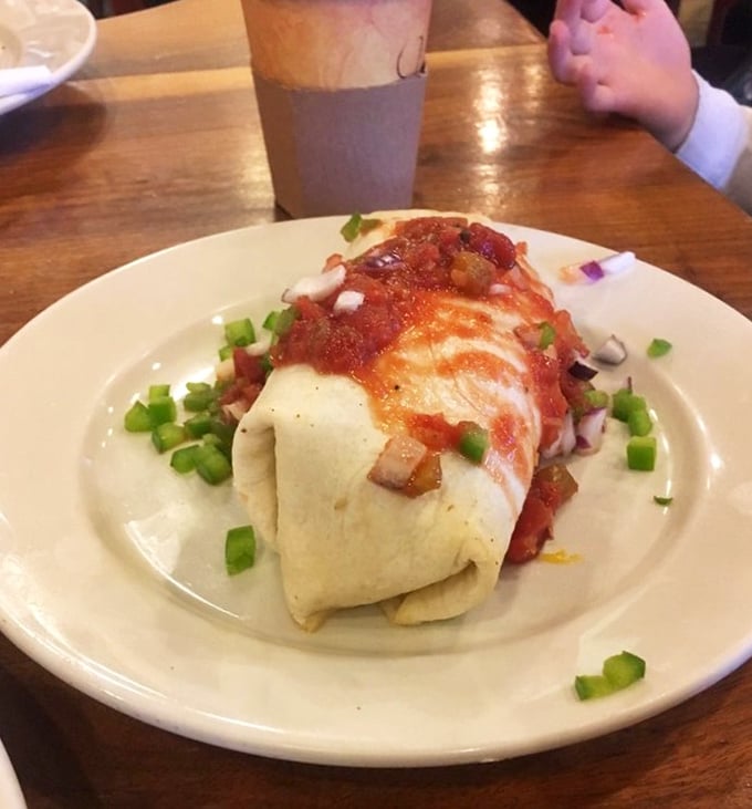 This isn't just a breakfast burrito—it's breakfast architecture. Layers of flavor wrapped in a tortilla blanket and crowned with a salsa tiara.