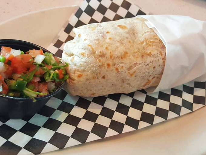 This breakfast burrito isn't just wrapped in a tortilla – it's wrapped in culinary glory. Fresh salsa stands by, ready for its supporting role in your morning masterpiece.