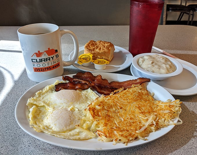 Breakfast perfection on a plate: golden hash browns, eggs with just-right yolks, and bacon that would make a vegetarian reconsider. 