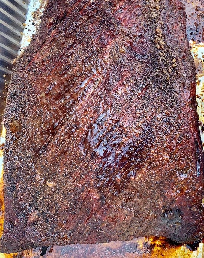 Behold the brisket bark – that peppery, caramelized exterior that makes grown adults contemplate driving across state lines.