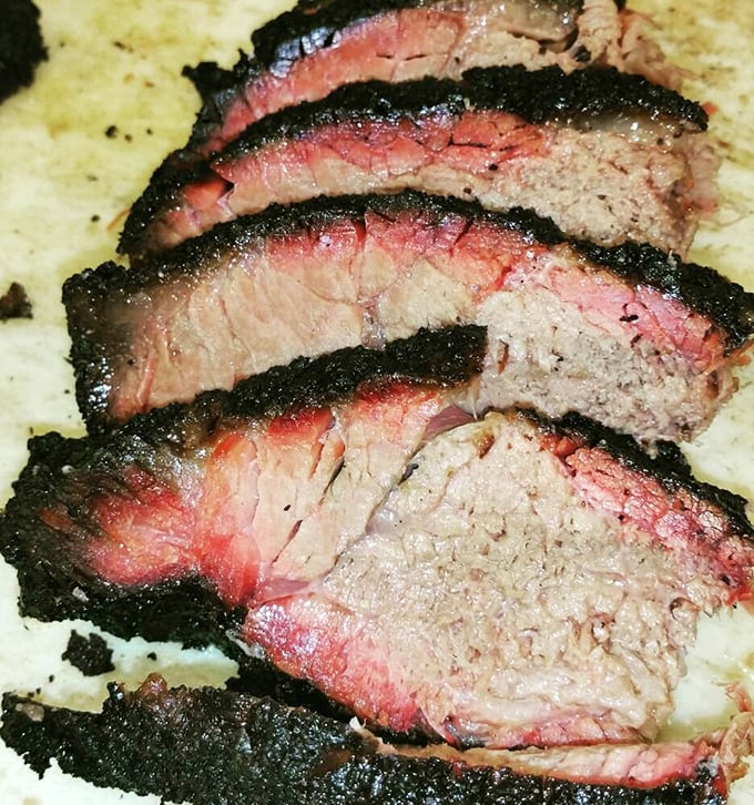 Behold the brisket in all its glory—that pink smoke ring is the BBQ equivalent of a Rolex. Each slice represents hours of patient craftsmanship.
