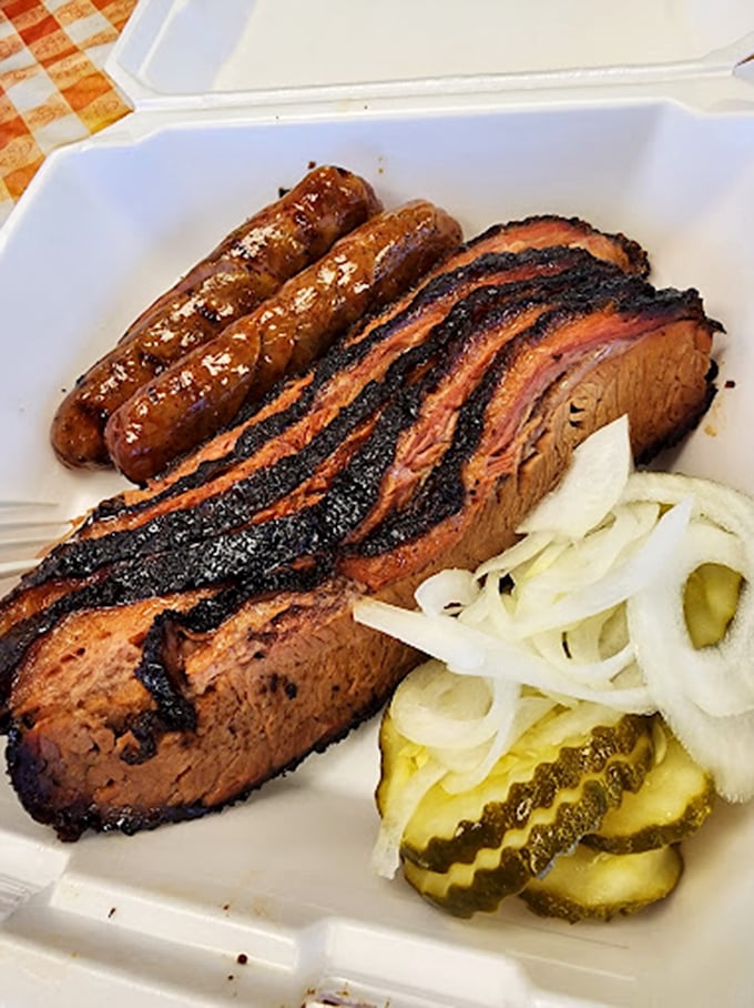 Brisket with that perfect pink smoke ring and glistening bark is barbecue's equivalent of finding the Holy Grail. The pickles and onions? Just bonus treasure.