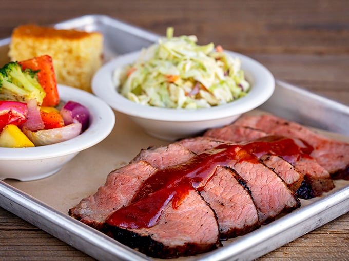 Brisket so perfectly sliced it belongs in a museum of meat artistry. That smoke ring isn't just pink—it's a halo of flavor.