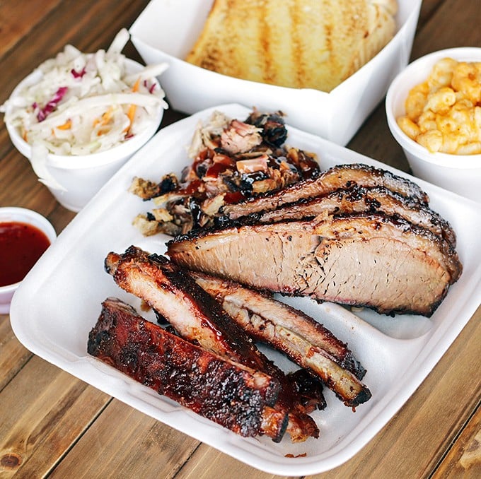 Behold the brisket plate—where smoke ring meets bark in perfect harmony. Those sides aren't afterthoughts; they're worthy companions to the star.