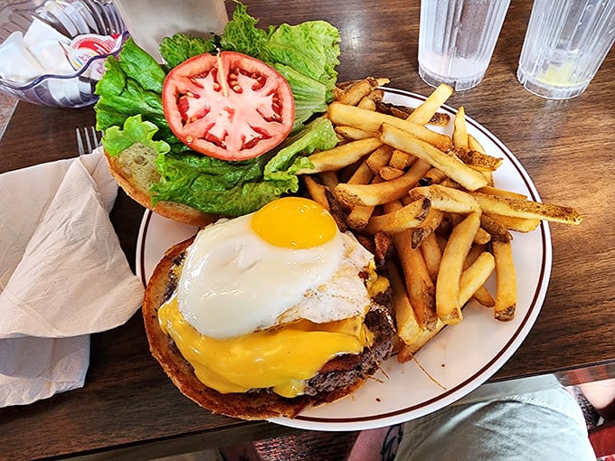 The burger that confused my calendar—is it breakfast or lunch? With that sunny-side-up egg crowning melted cheese, who cares what time it is?