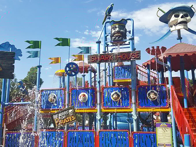 Buccaneer Cove's "Shark House" water playground offers sweet relief from Riverside's infamous heat. Pirates, water cannons, and gleeful screams – childhood summer perfection.