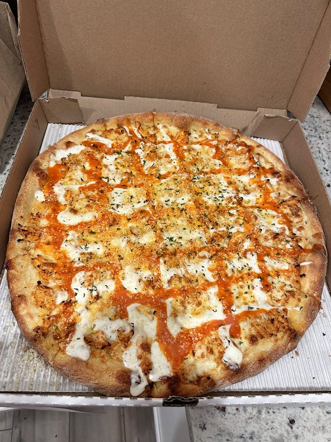 This golden-crusted masterpiece showcases Dino's perfect balance of sauce, cheese, and toppings – proof that pizza perfection doesn't need fancy ingredients, just proper execution.