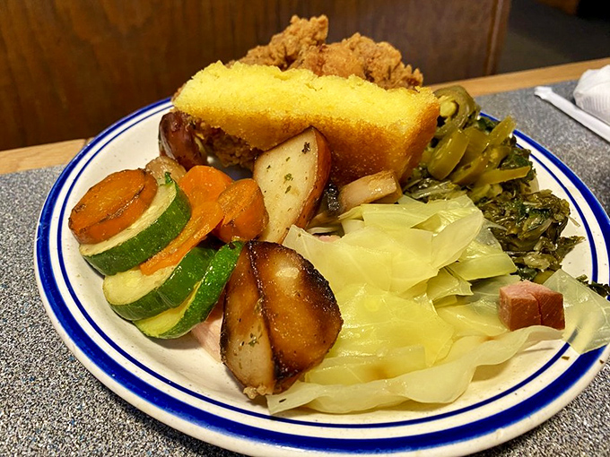 A plate that tells the story of buffet strategy—a little of this, a touch of that, and somehow cornbread always makes the final cut.