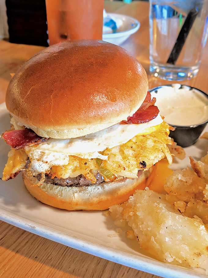 The Breakfast Burger—where morning meets midday in a symphony of runny egg, crispy bacon, and beef. Your diet plan's arch-nemesis has never looked so glorious.