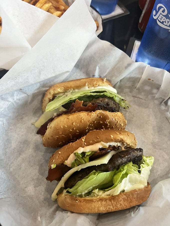 The ABC Burger arrives like edible architecture—perfectly charred patty, crisp bacon, and fresh avocado creating California's answer to burger perfection.