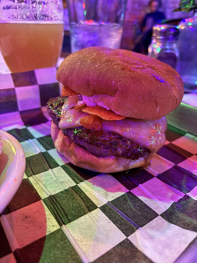 This isn't just a burger—it's edible architecture with a PhD in flavor. The perfect char, melty cheese, and that bun deserves its own fan club.