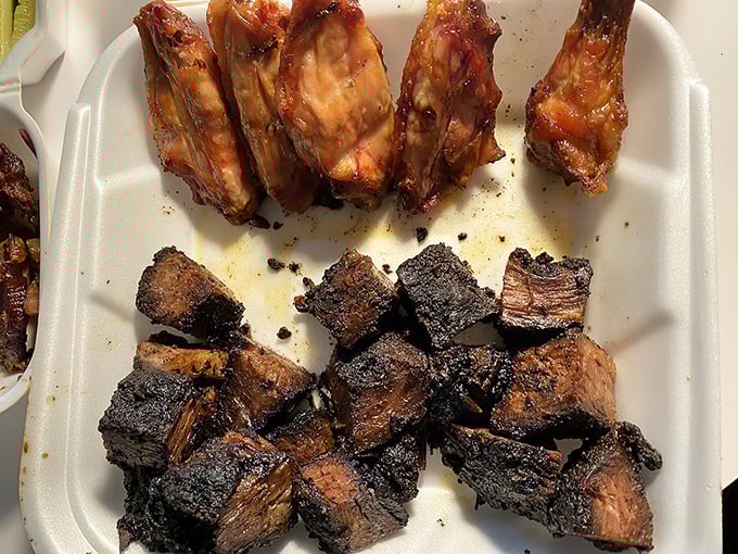 Behold the burnt ends in all their blackened, bark-encrusted glory. These aren't just meat cubes—they're flavor bombs that make vegetarians question their life choices.