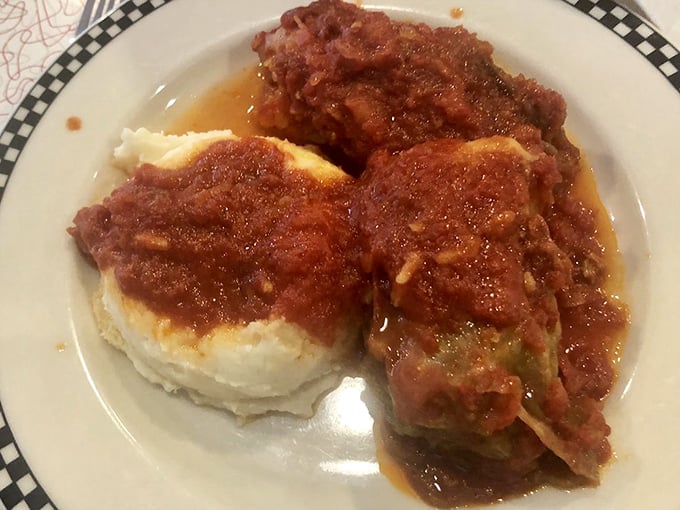 These aren't just cabbage rolls—they're edible time machines. Tender cabbage wrapped around seasoned filling, swimming in that glorious homemade sauce.