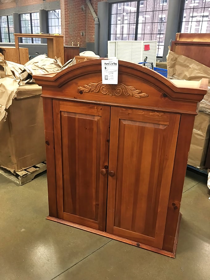 This isn't just furniture—it's someone's future heirloom. A solid wood cabinet with ornate detailing that would cost a fortune new sits patiently for its next home.