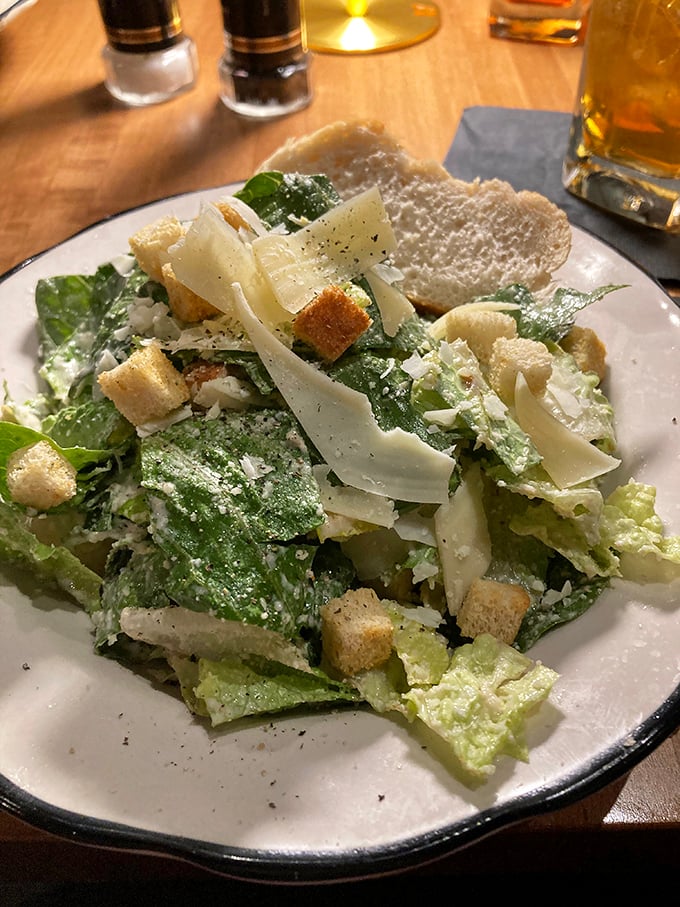 Not just any Caesar salad—this one's a textural symphony of crisp romaine, shaved parmesan, and house-made croutons that might make Julius himself weep with joy.
