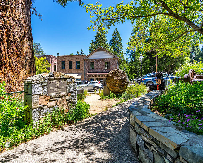 Stone walls and historic buildings create a peaceful oasis at Calanan Park, where Gold Rush history meets meticulously maintained gardens.