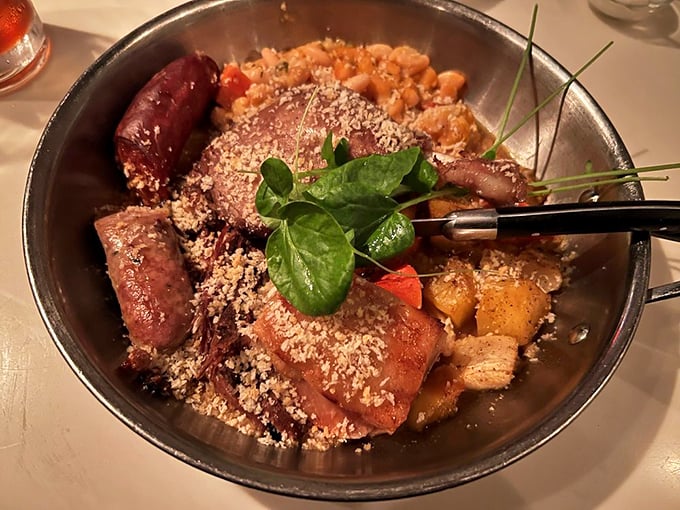 This isn't just dinner—it's edible architecture. Layers of sausage, beans, and meat create a cassoulet that would make a Frenchman weep with joy.
