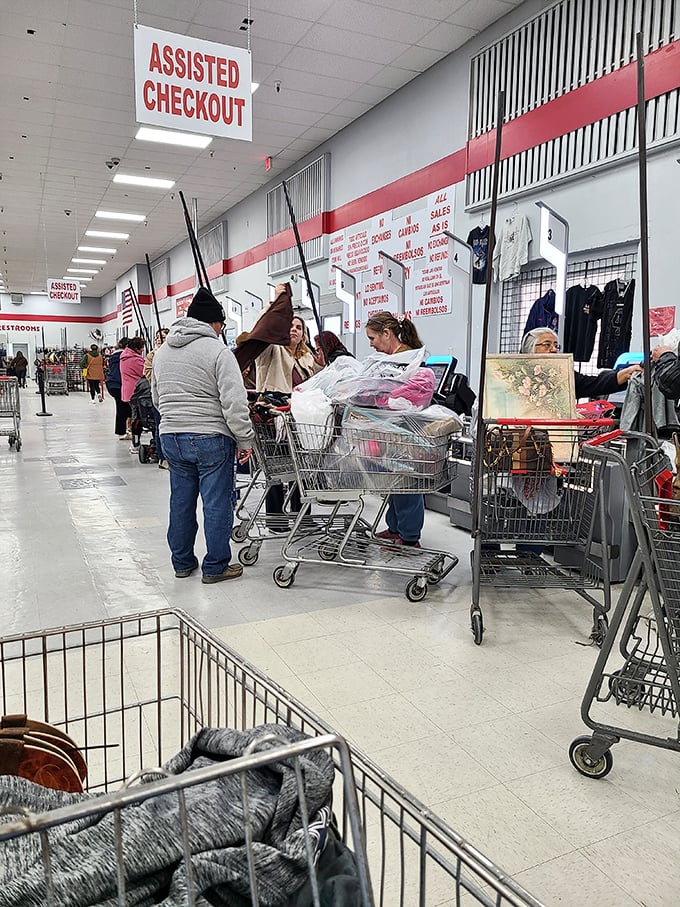 The "Assisted Checkout" area, where shopping carts overflow with potential and shoppers exchange knowing glances that say, "Yes, I scored big today."
