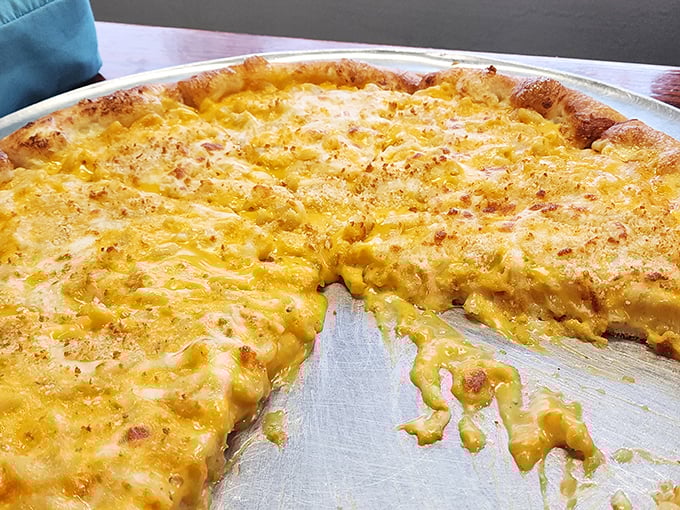 Behold the mac and cheese pizza in all its golden glory – comfort food having a love affair with more comfort food.