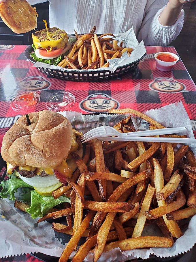 This isn't just a burger—it's edible architecture. Golden fries, melty cheese, and a perfectly toasted bun create the kind of meal that makes conversation stop mid-sentence.