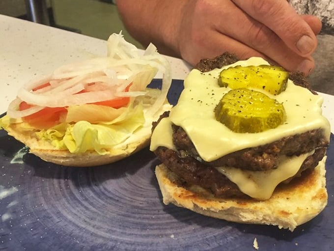 This isn't just a burger; it's edible architecture with layers of melty cheese, pickles, and beef that'll make your taste buds stand at attention.