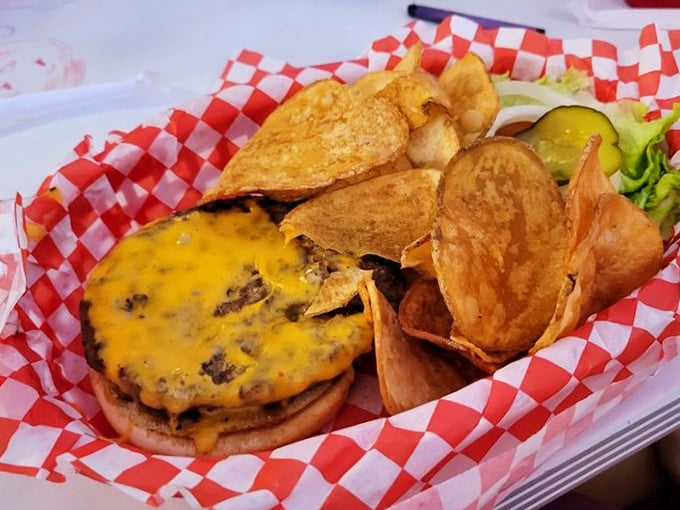 This isn't just a cheeseburger—it's a masterpiece of melted American cheese cascading over a hand-formed patty, with house-made chips that shatter like vinyl records.