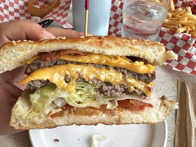 This isn't just a cheeseburger – it's edible architecture. Layers of beef, cheese, fresh veggies, and special sauce create the perfect bite every time.