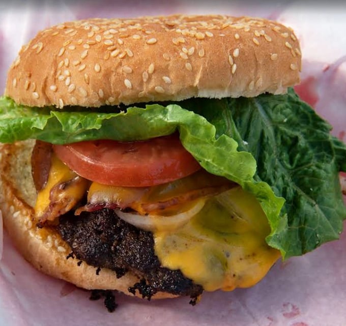 A burger that doesn't need a fancy name or artisanal pretensions—just perfectly seasoned beef, melty cheese, and fresh toppings that speak the universal language of satisfaction.