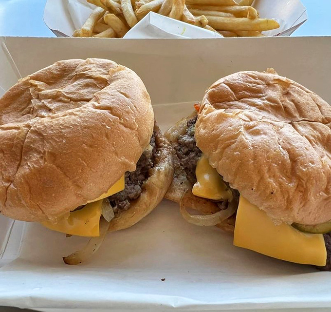 These aren't just cheeseburgers—they're time machines. One bite transports you to a simpler era when happiness came between two buns.