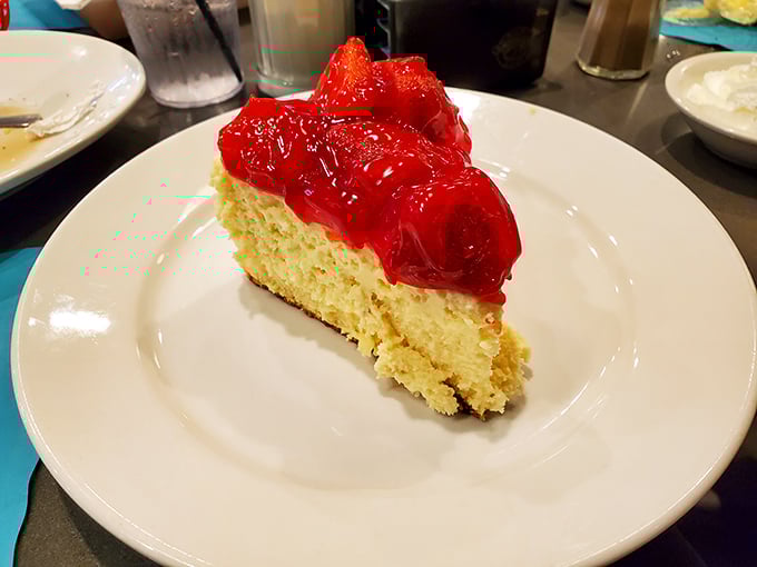 That strawberry cheesecake isn't just dessert—it's therapy with a graham cracker crust. The kind of slice that makes you question why salads were ever invented.