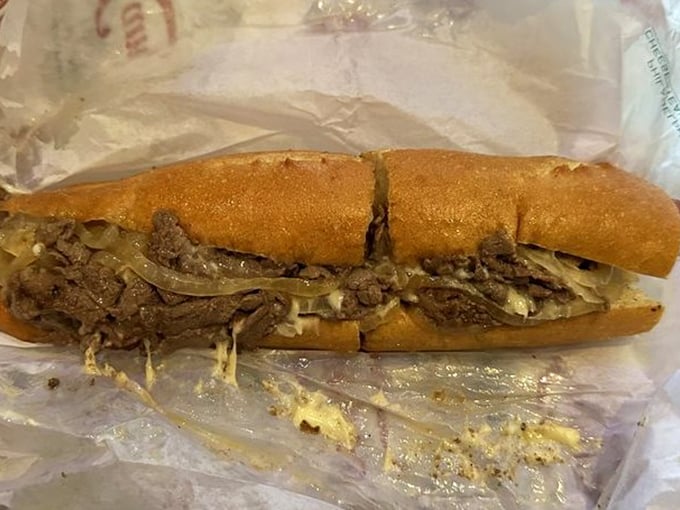 Behold the holy trinity of Philly cheesesteak perfection: tender ribeye, melted cheese, and that roll—oh that roll! A sandwich that justifies crossing state lines.