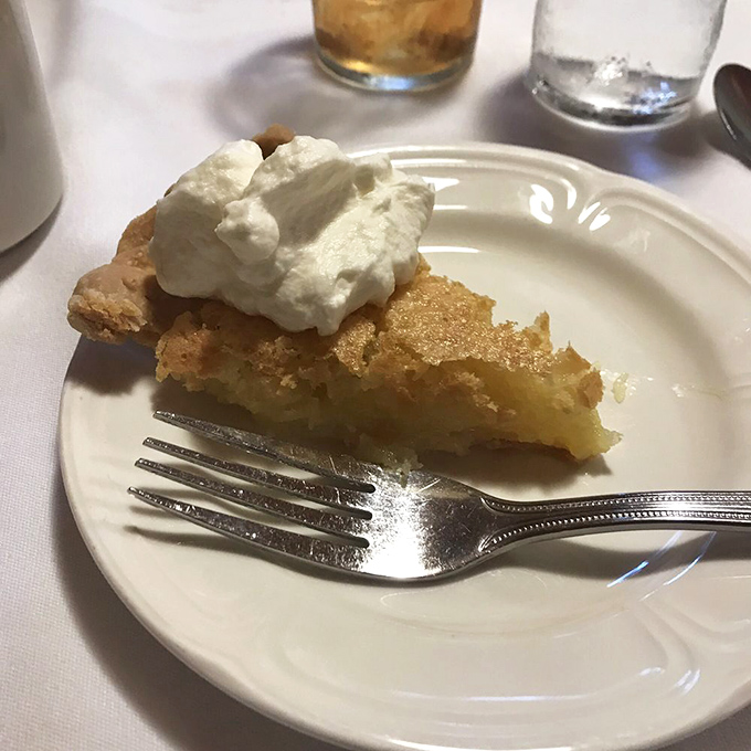 Chess pie perfection – that magical crust-to-filling ratio with a dollop of whipped cream that doesn't ask permission before changing your life forever.