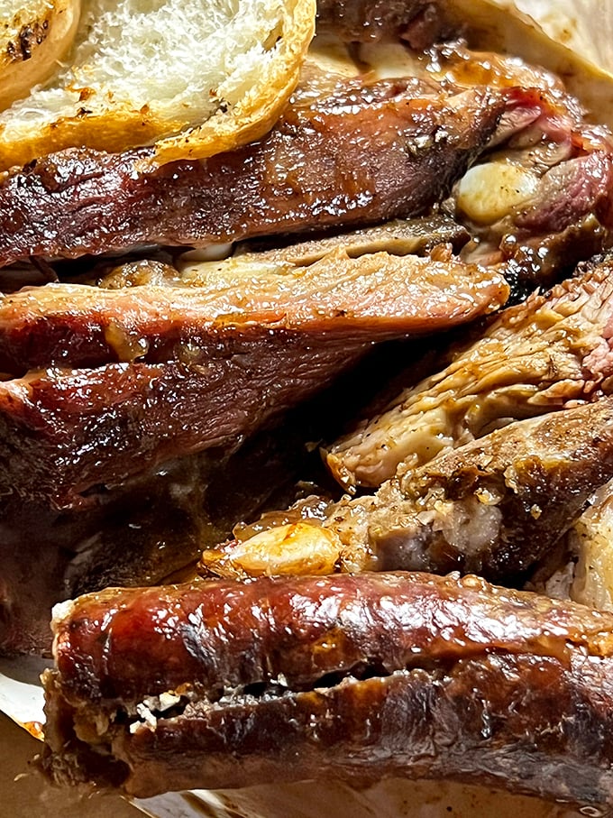 These aren't just ribs; they're edible time machines transporting you to a moment when nothing matters except the perfect balance of smoke, meat, and sauce.