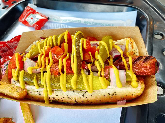 Behold the Chicago Dog in all its glory! That poppy seed bun cradling a symphony of toppings—proof that sometimes more IS more.